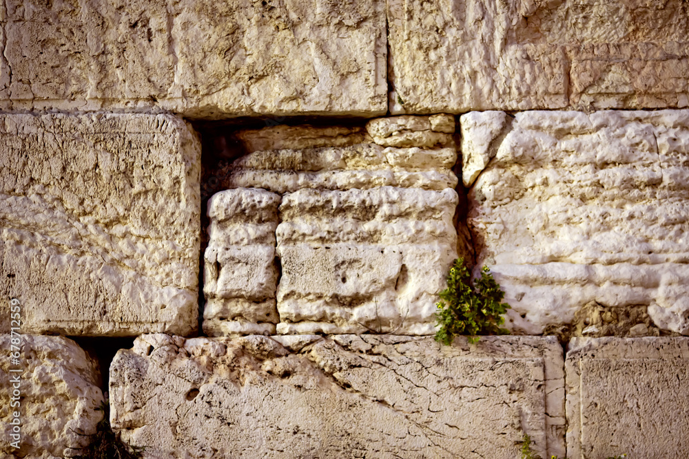 Texture of the stones with notes inserted in crevices of the Western ...