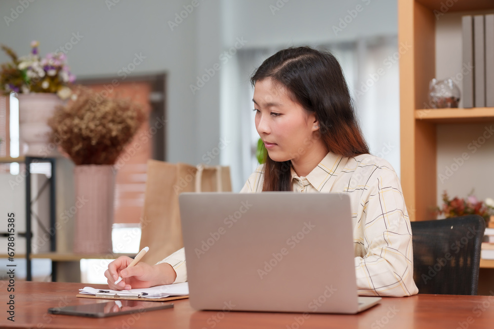 Office woman sitting working in front computer screen placed on table ...