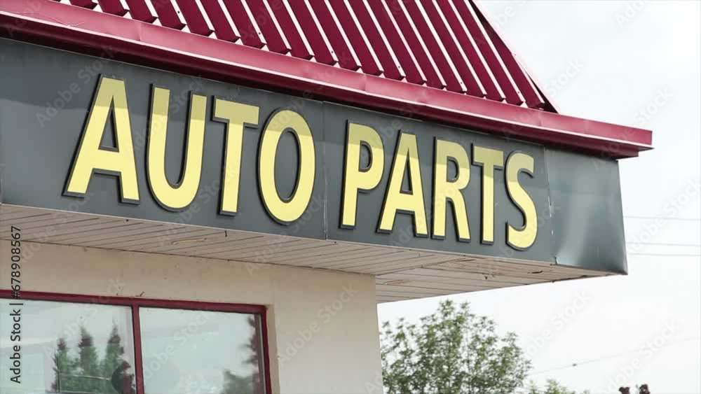 auto parts sign facade with roof above and windows below on storefront ...