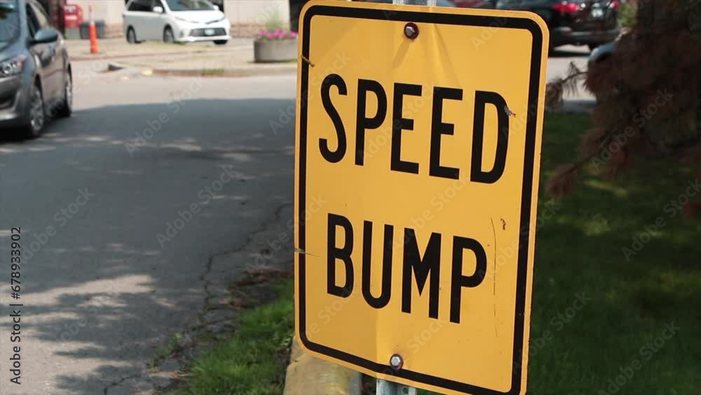 speed bump caption text writing rectangle metal sign with car passing ...