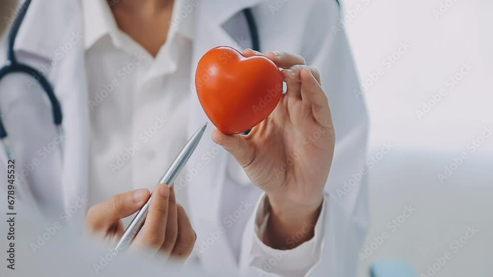 The doctor explains the anatomy of the structure of the heart on the ...