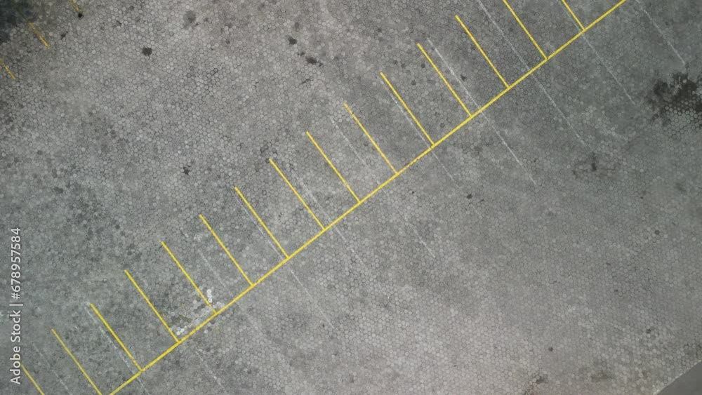 4k Aerial view of outdoor vehicle parking area in urban areas with ...