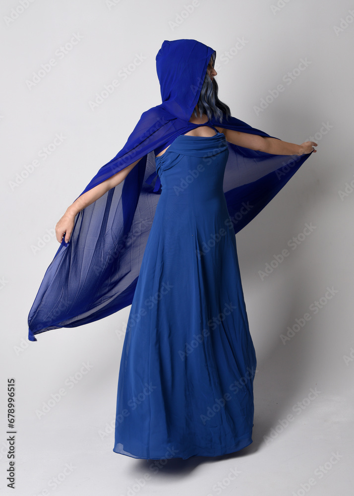 Full length portrait of beautiful female model wearing elegant fantasy ...