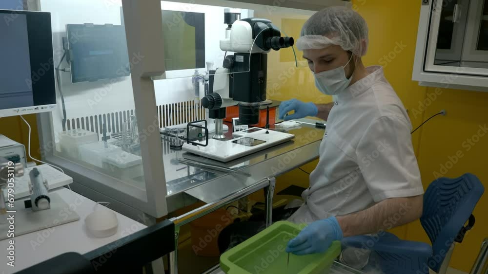 Medical doctor using the modern ivf equipment at the pregnancy clinic ...