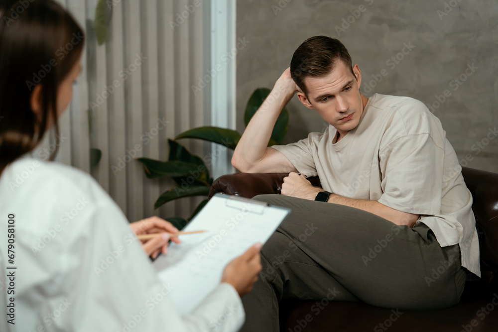 Stressed and depressed patient seeking help from psychiatrist with ...