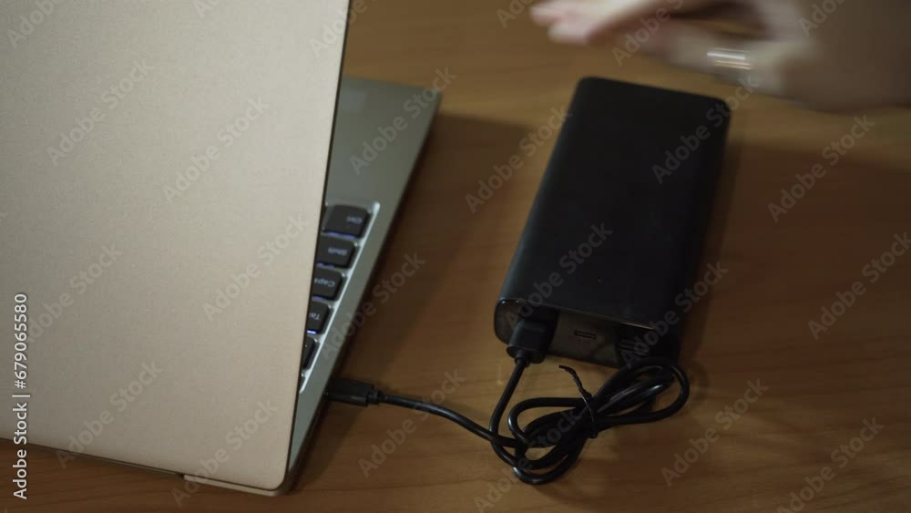 Connect the USB cable to an external Power Bank battery to charge the ...