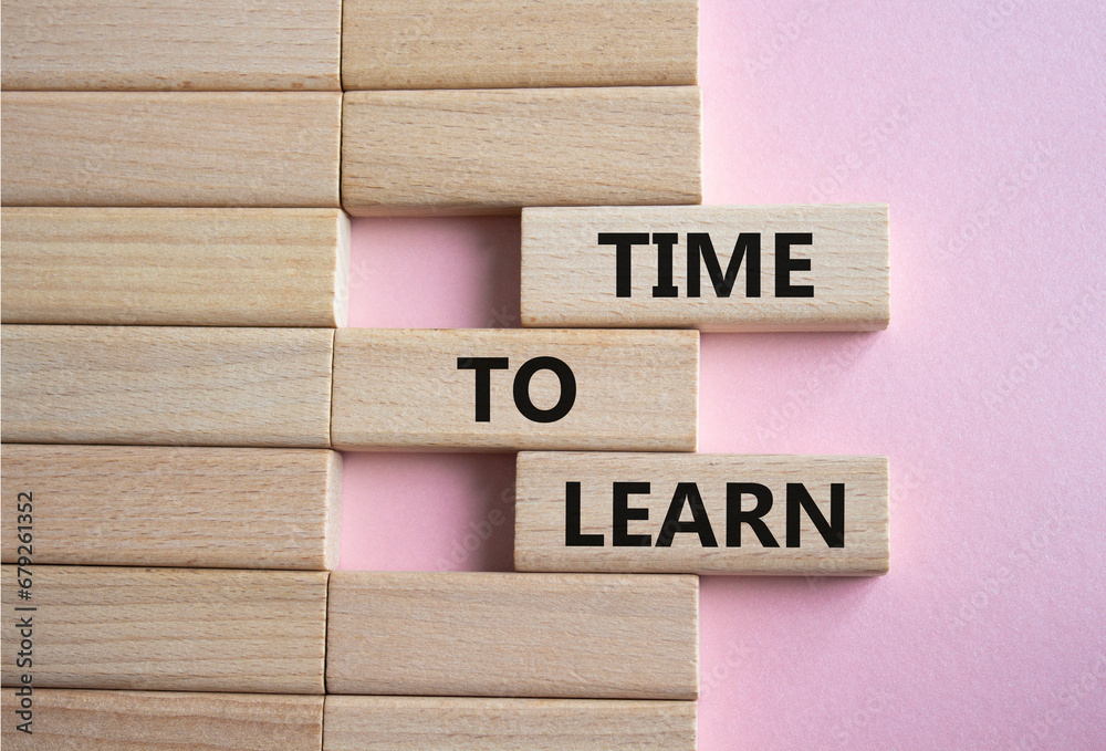 Time to learn symbol. Wooden blocks with words Time to learn. Beautiful ...