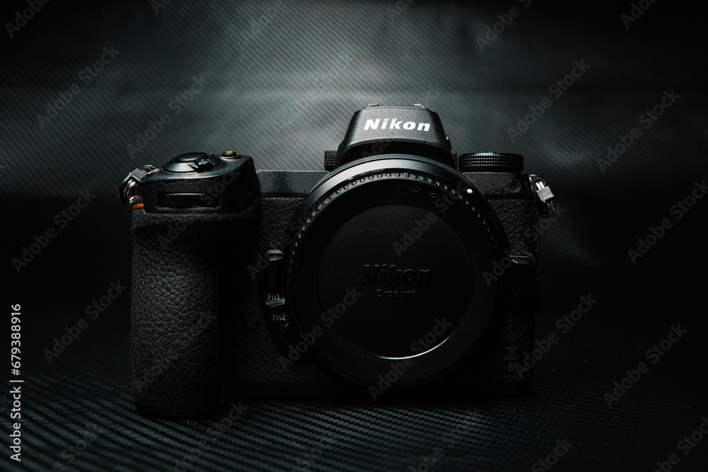 Nikon Z6 digital SLR camera is illuminated by a bright flash in a dark ...