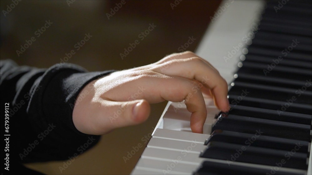 Big hands on the keys of the synthesizer. The musician plays the ...
