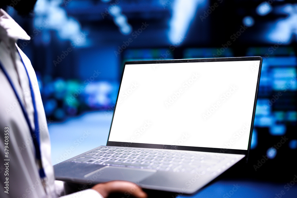 Manager inspecting server rackmounts doing intense computations. Supervisor using mock up tablet ...