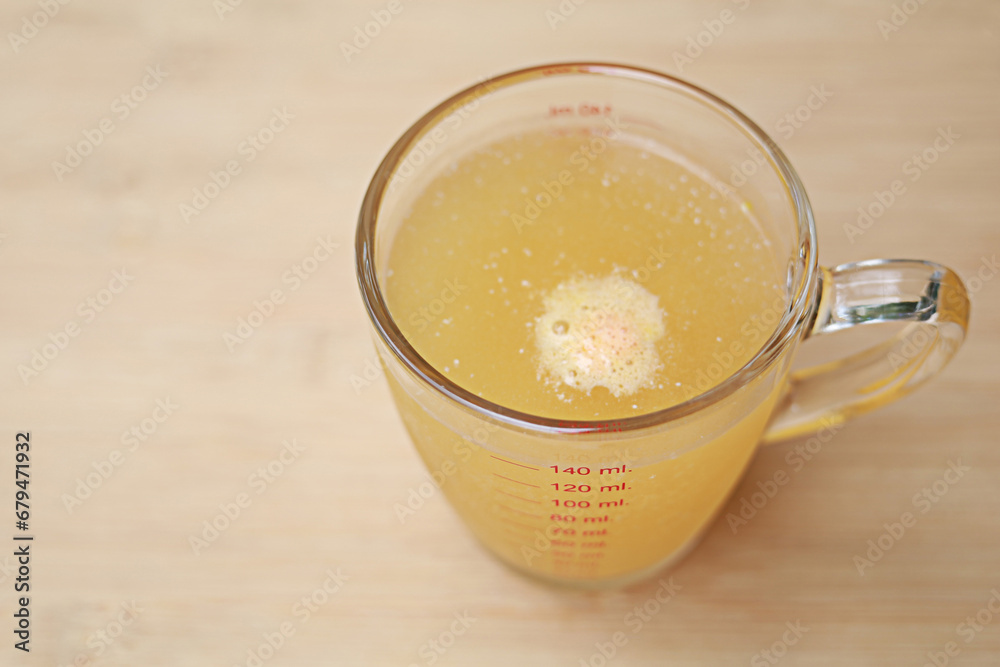 Effervescent tablets melting in glass, top view shot, copy space empty ...