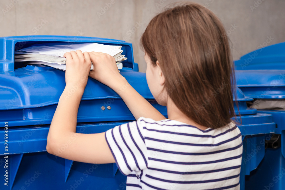 Recycling Paper Waste. Girl Trowing Paper Waste into Blue Wastebasket ...