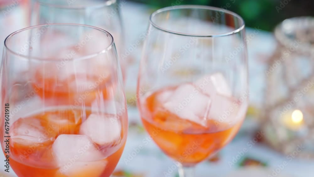 Traditional Italian Aperol Spritz preparation under the open air party ...