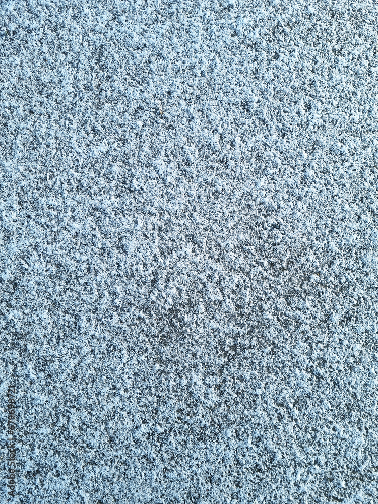 The texture of the snow on the ground or on the asphalt in winter ...