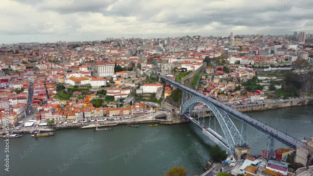 Cinematic aerial view of Porto city, River Douro and Dom Luis I Bridge ...
