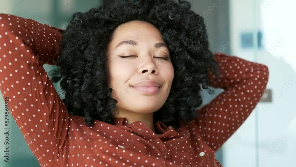 Young african american female employee relaxing with her eyes closed ...