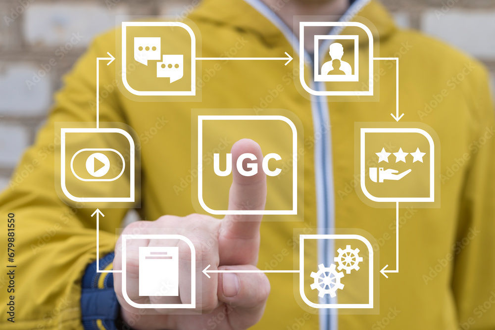 Man using virtual touch screen presses abbreviation: UGC. UGC User ...