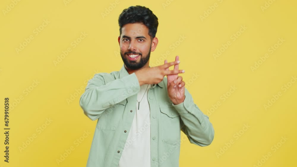 Hashtag. Indian man showing cross symbol with fingers, likes tagged ...