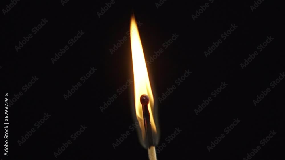 Close up lucifer stick with burning flame, black screen background ...