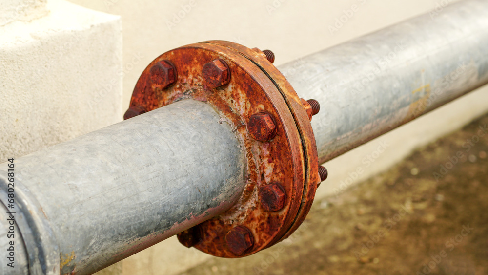 Rust corrosion flange and bolt on the old steel water pipeline ...