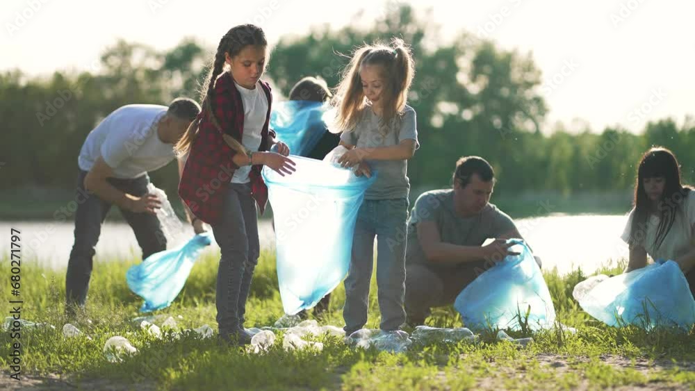 Teamwork.Group of people volunteers clean up plastic garbage together ...