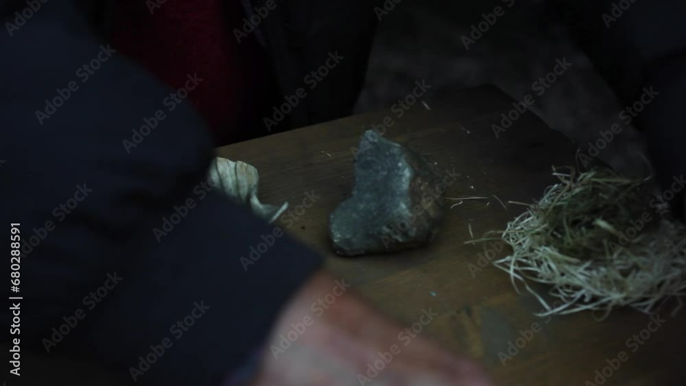 Vidéo Stock Experience ancient firecraft: skilled hands blend fungus ...