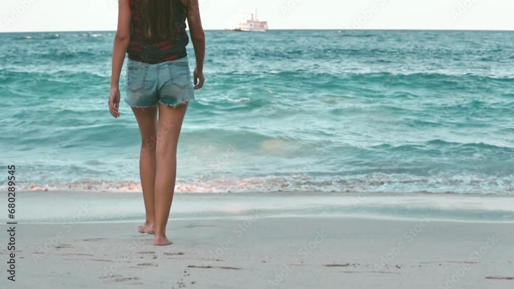 Woman walking sand beach slow motion, ocean waves splashing seashore ...