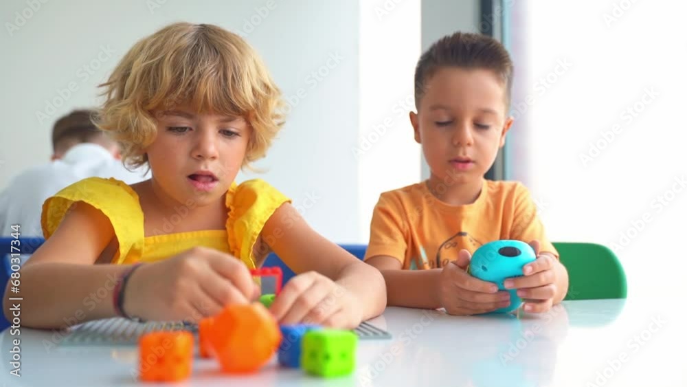 Children playing with electronic toy car control panel using joystick ...