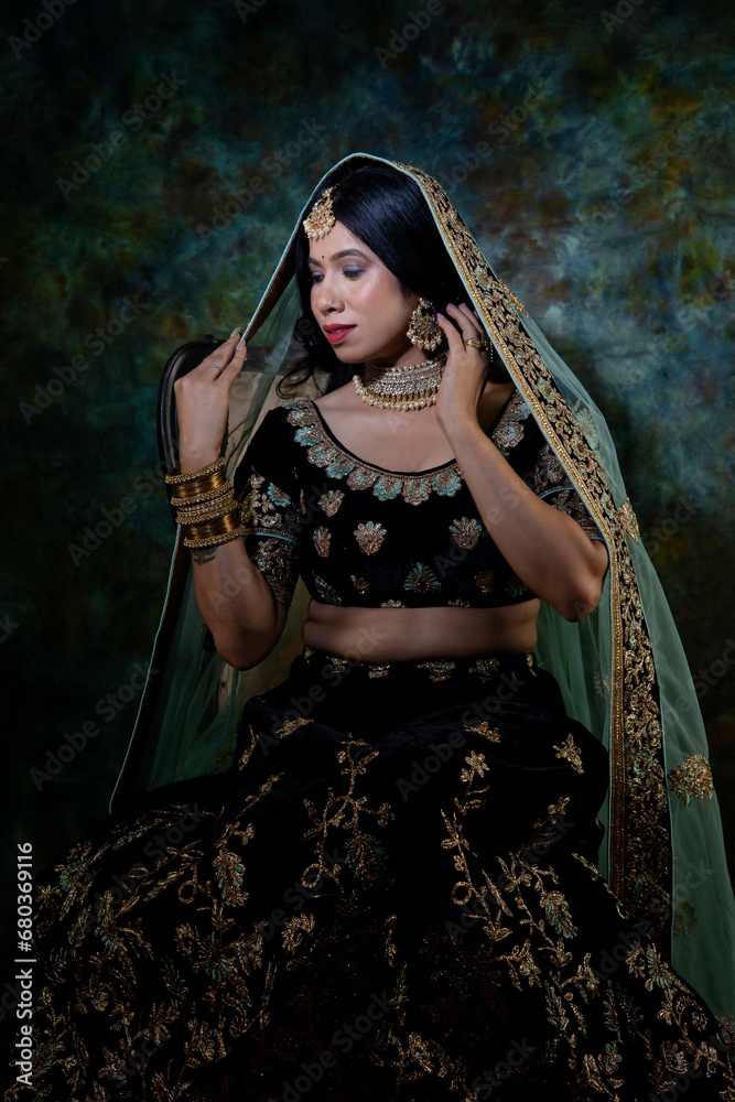beautiful indian woman in brown bridal lehenga with green dupatta over ...