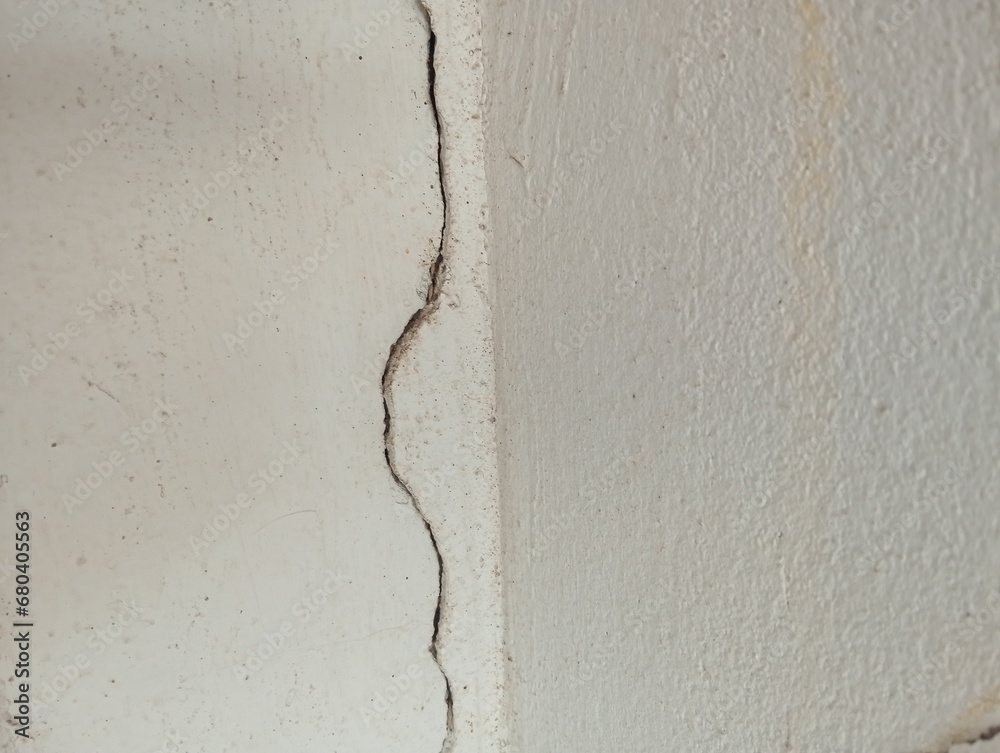 Cracked concrete building broken wall at the outside cement corner that ...