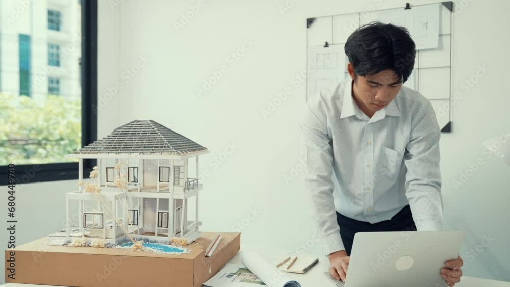 Close up of professional male architect engineer measure house model ...