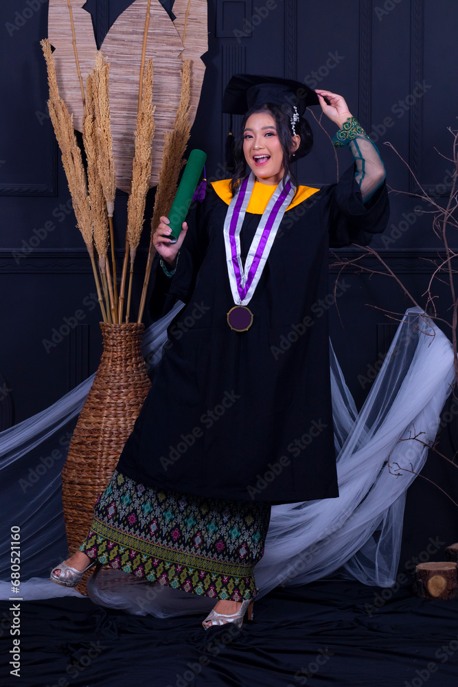 Beautiful Asian girl graduating, cheerful smile, hands holding diploma ...