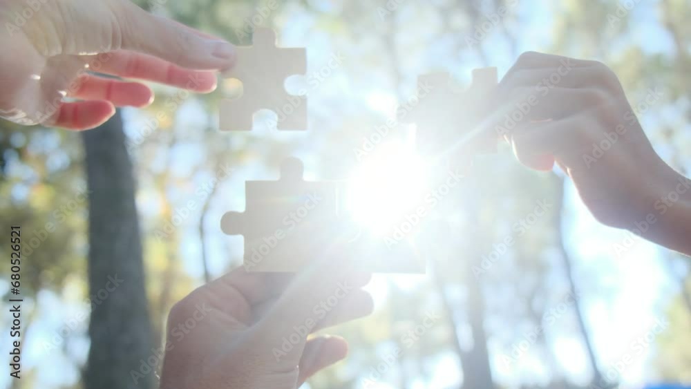 Diverse hands unite, expertly crafting a puzzle mosaic—a vivid tableau ...