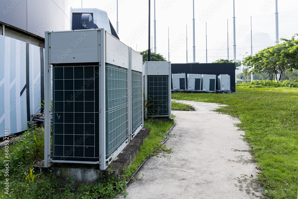 Air conditioner compressor installed in old building. Outdoor split ...