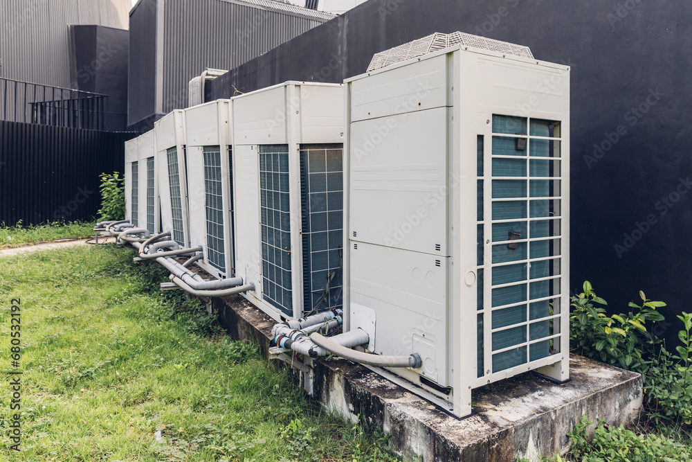 Air conditioner compressor installed in old building. Outdoor split ...