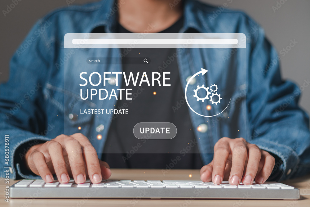 Man typing keyboard with installing update process. Software updates or ...