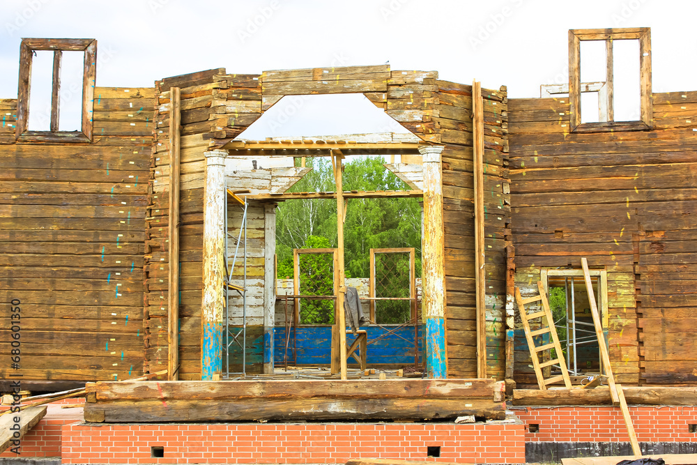 Building a residential wooden house. Facade of unfinished building ...