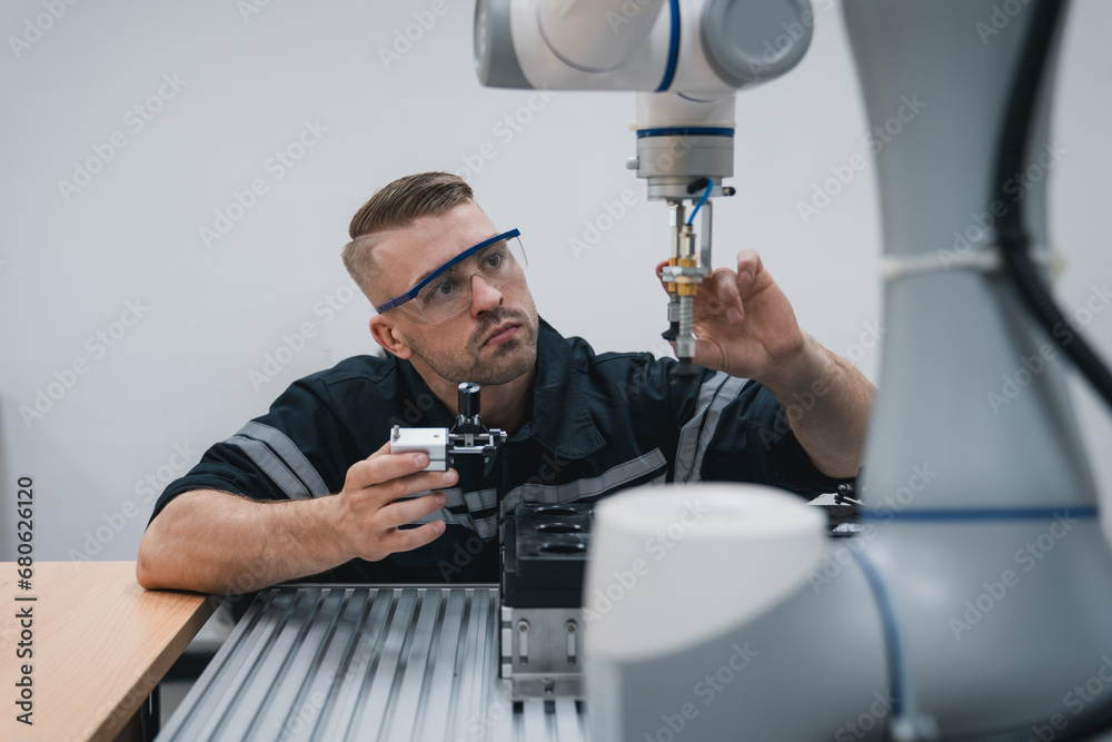 Student engineer Assembling Robotic Arm with computer in Technology ...