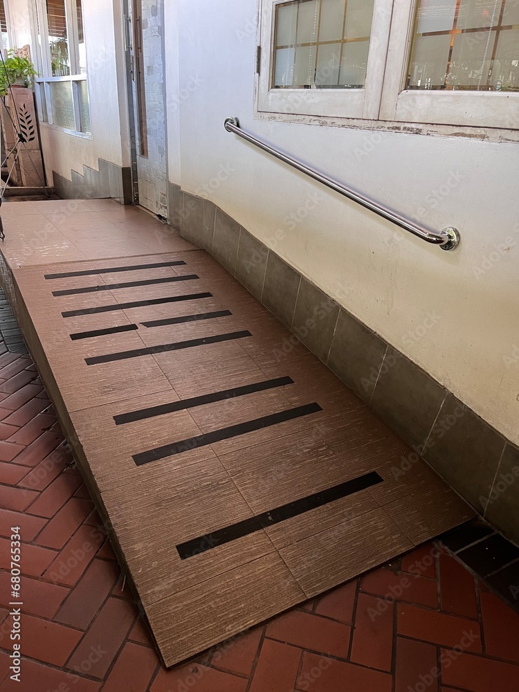 Disabled ramp installed at the corner of building. Standard ...