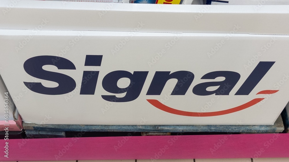 Signal toothpaste and toothbrush logo brand and text sign on display ...