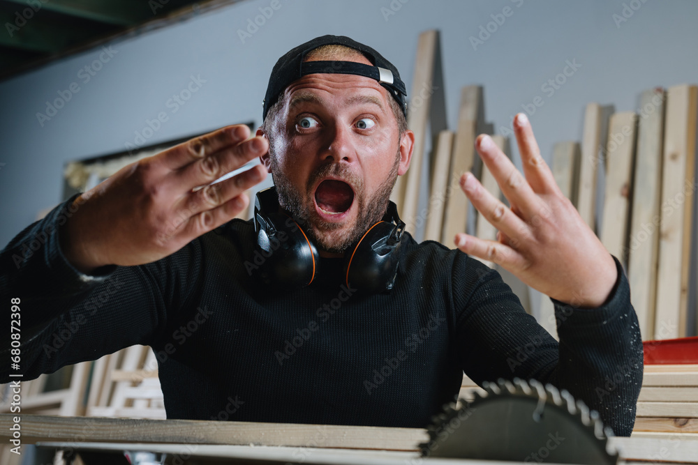 An emotional portrait of a carpenter who imitates severed fingers. The ...