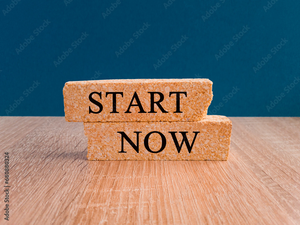 Start now symbol. Concept words Start now on beautiful brick blocks ...
