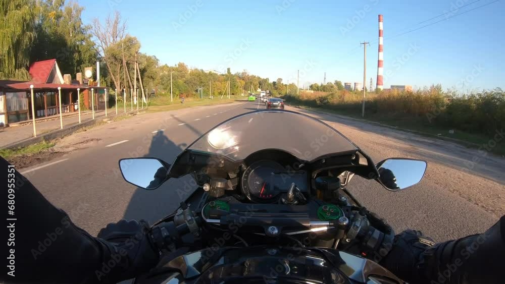 Point of view of a motorcycle rider rides in country road with traffic ...