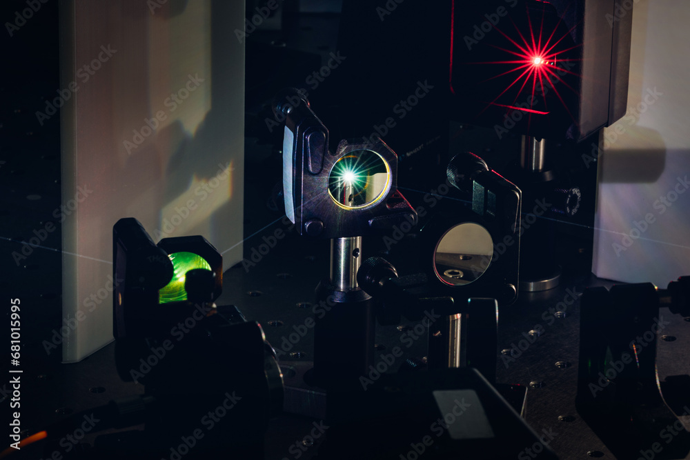 Experiment with laser device in optical laboratory. Experiment in optic ...