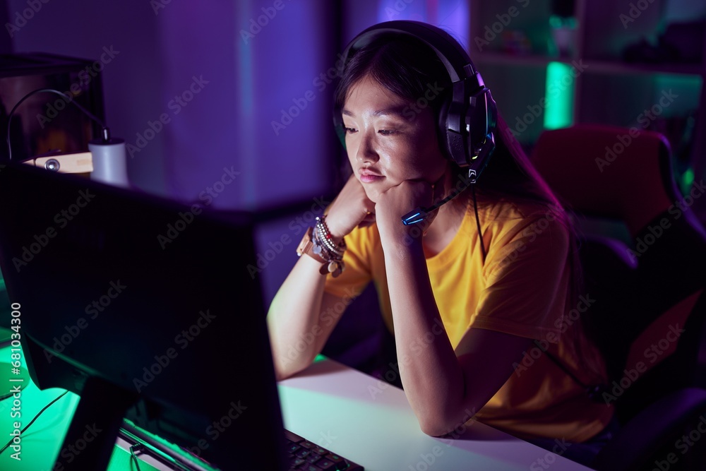 Chinese woman streamer stressed using computer at gaming room Stock ...