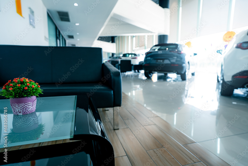 Blurred car parked in luxury showroom. Car dealership office. New car ...