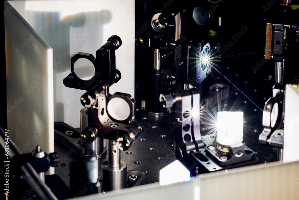 Experiment with laser device in optical laboratory. Experiment in optic ...