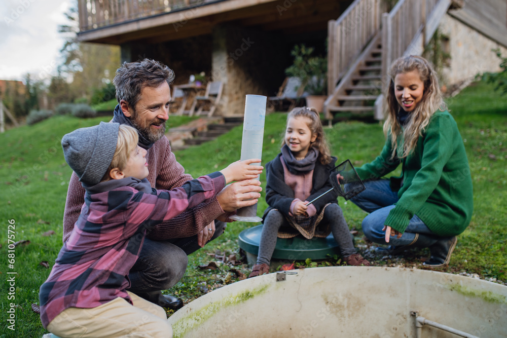 The family checks the water quality in the home wastewater treatment ...