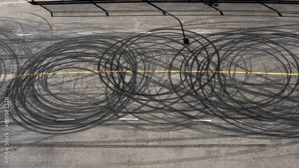 Top view curving tire marks from professional car drifting on asphalt ...