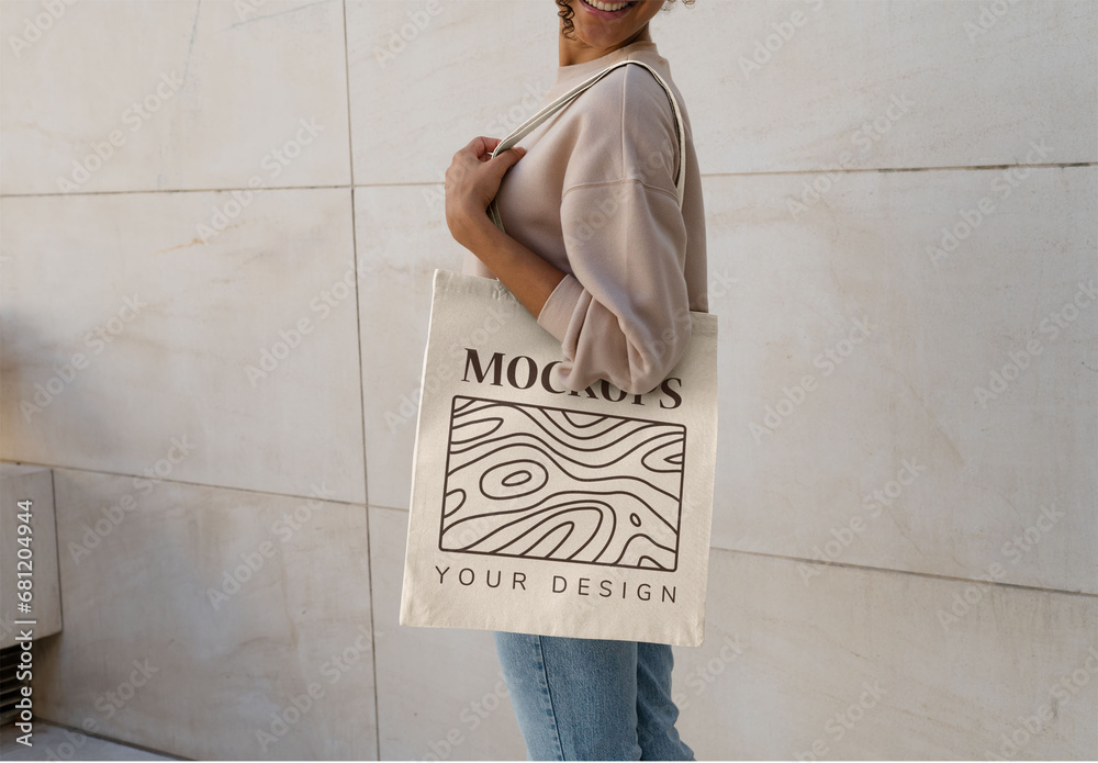 Mockup of woman holding customizable tote bag, side view Stock Template ...